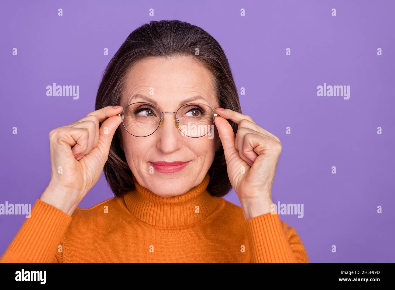 Photo of cute thoughtful lady pensioner dressed orange turtleneck arms ...