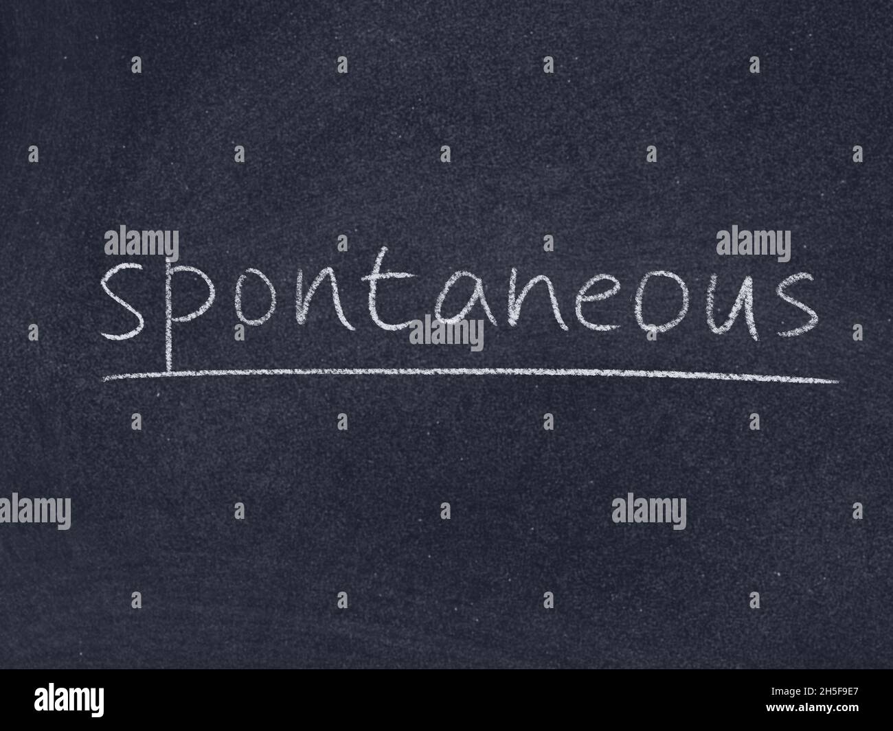 spontaneous concept word on blackboard background Stock Photo - Alamy