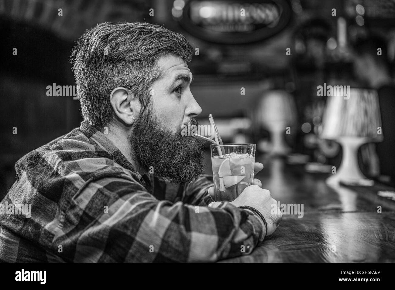 Tropical alcoholic fresh cocktail. Barman in pub or restaurant. Bearded ...