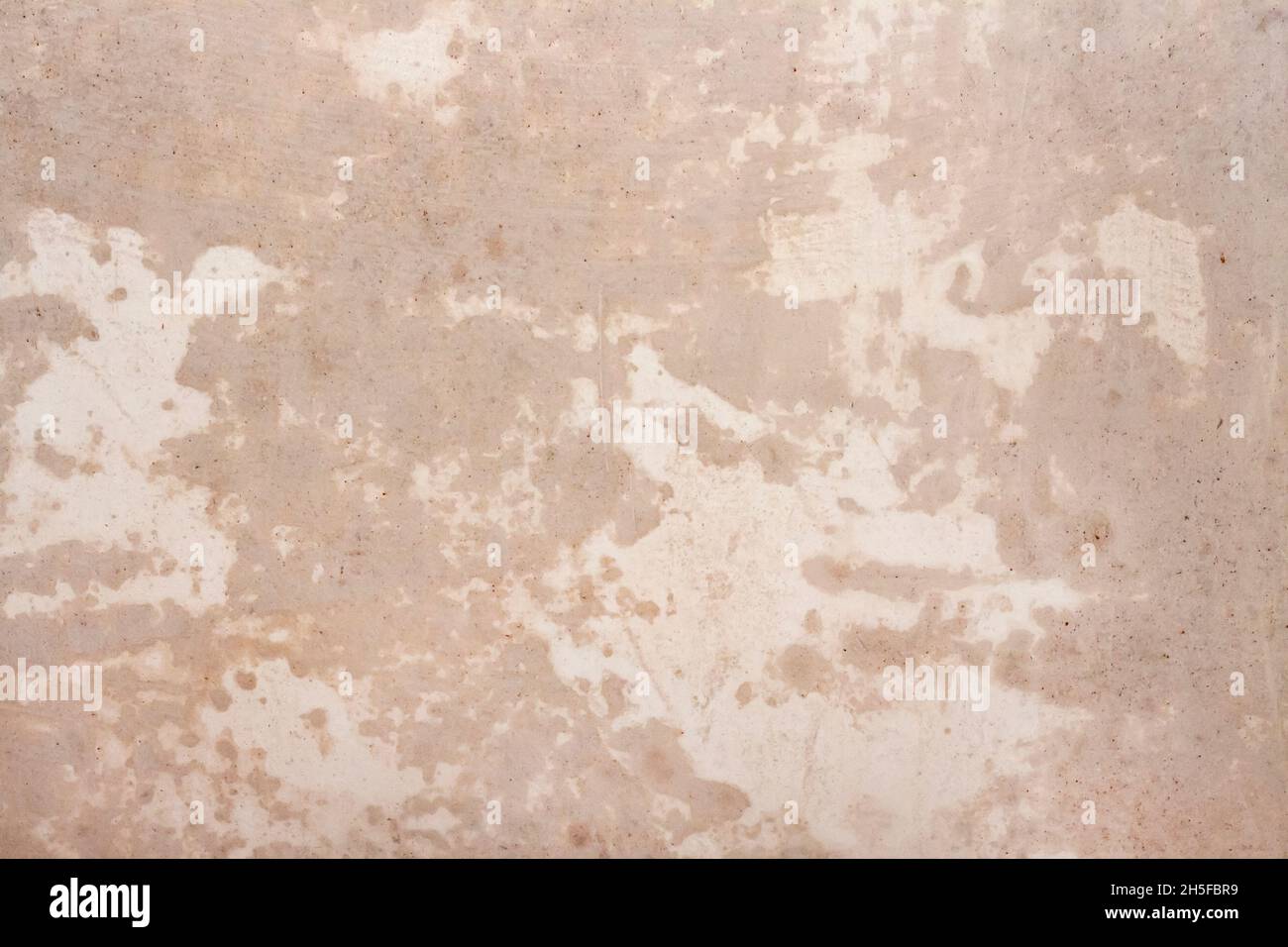 Beige plastered wall covered with fresh primer texture background Stock ...