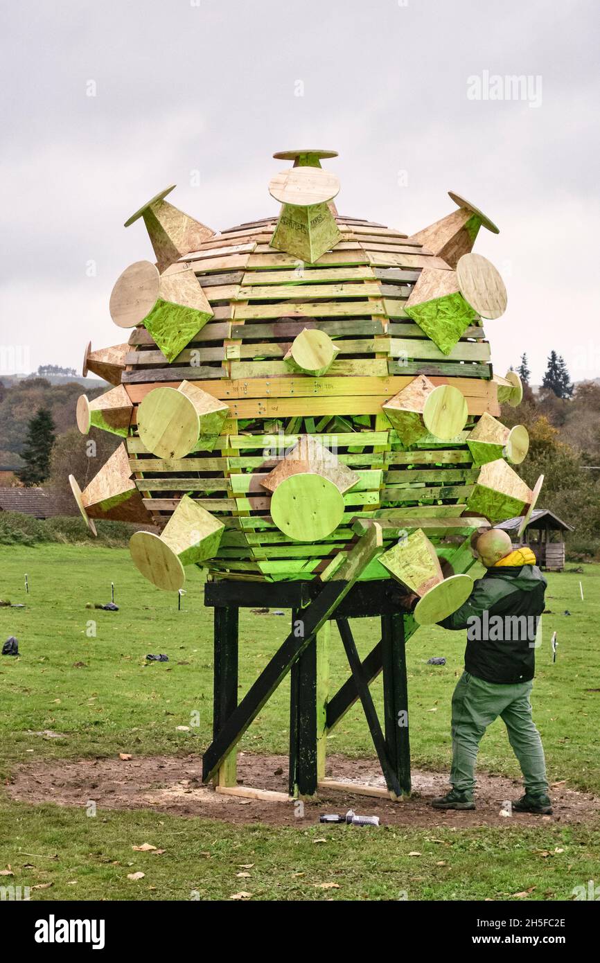Building a bonfire in the shape of a giant model of a coronavirus, to ...