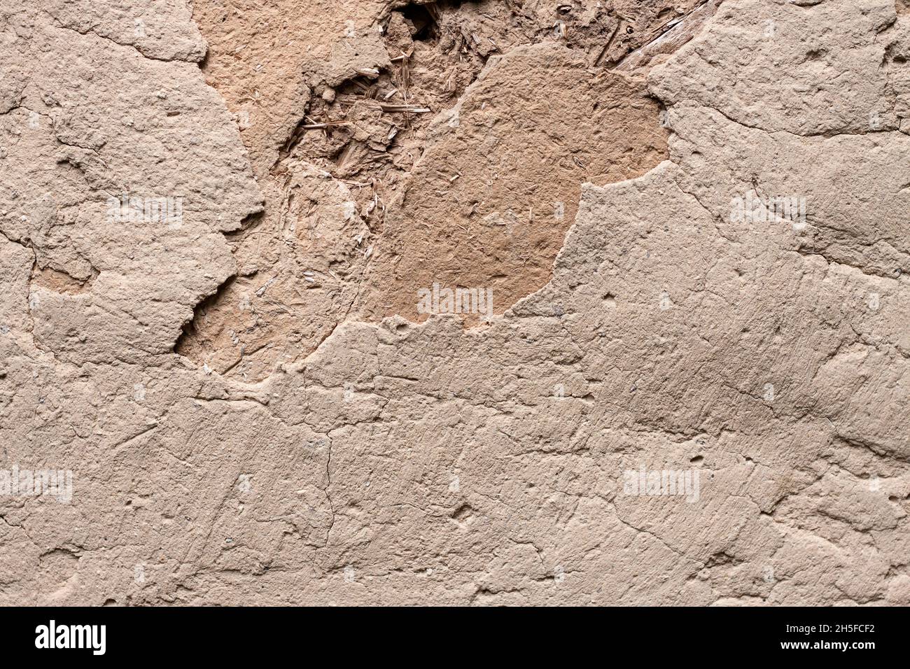 Old cob wall with cracked surface. Vintage background for design ...