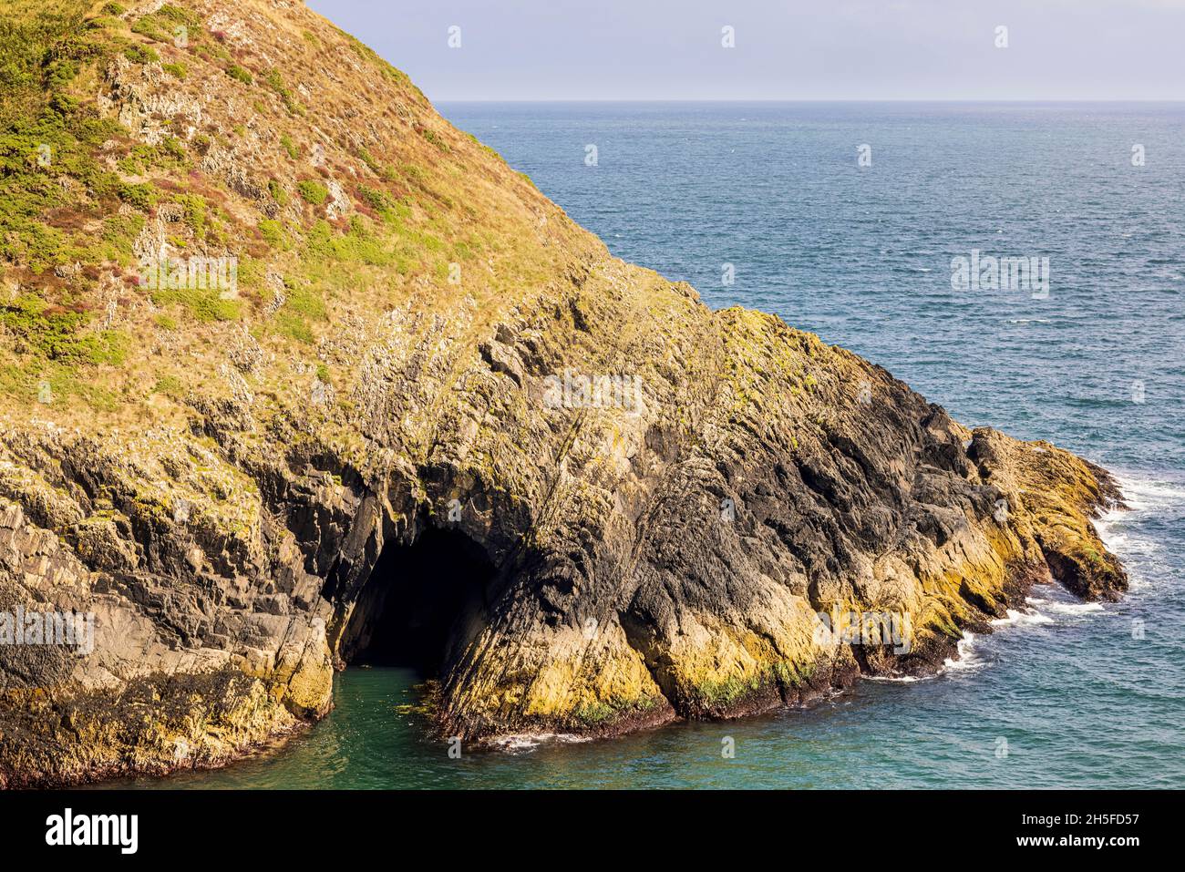 Cave in the sea cliffs at Roberts Cove, County Cork, Ireland Stock ...