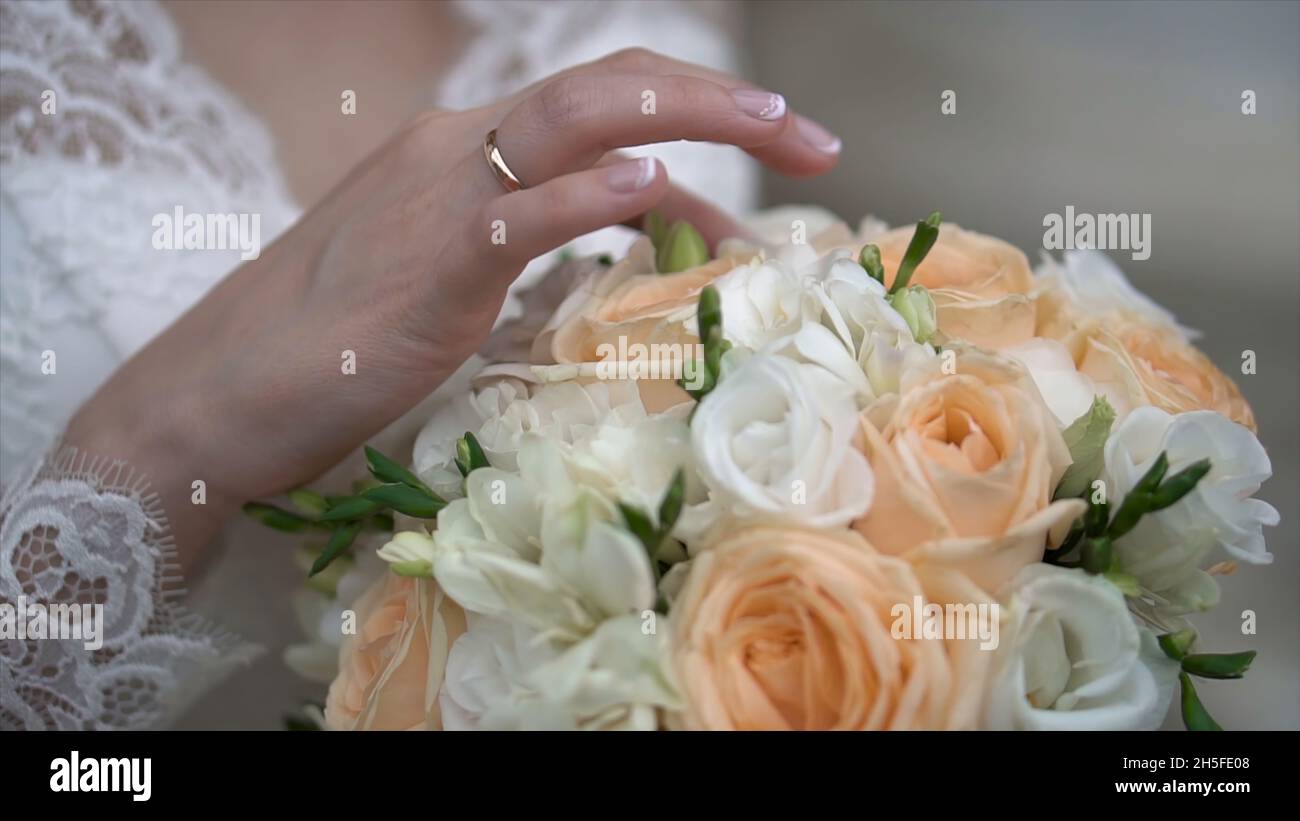 Nice wedding bouquet in bride's hand. Clip. Fiancee in a beautiful ...