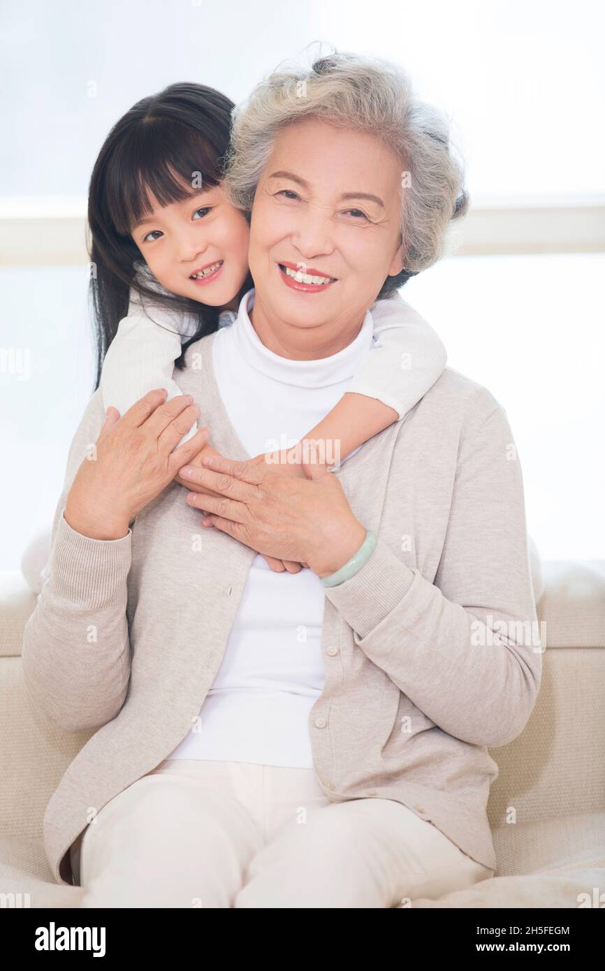 Grandmother granddaughter sitting face face hi-res stock photography ...