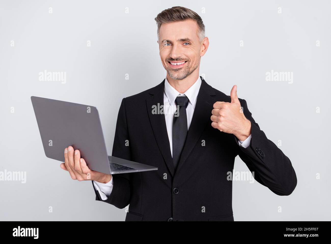 Photo of confident happy young programmer wear black jacket showing ...