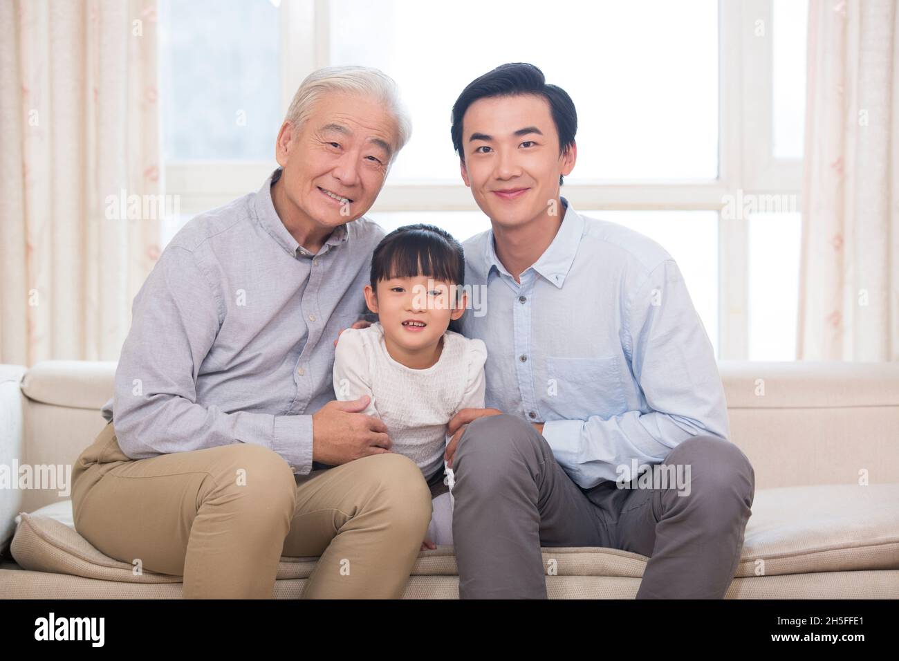 Three generations of a happy family Stock Photo - Alamy