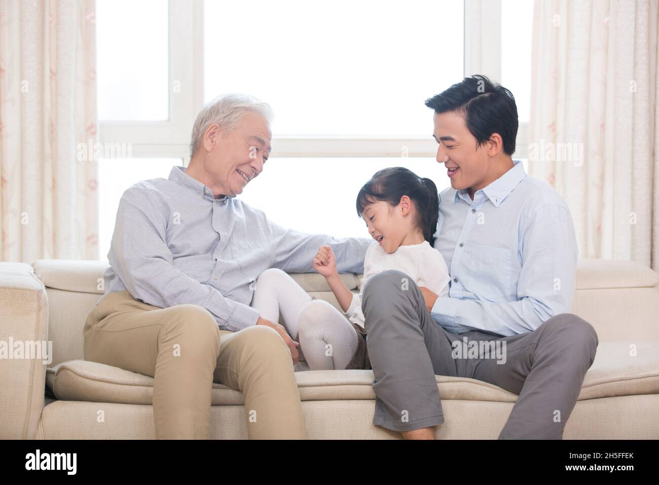 Three generations of a happy family Stock Photo - Alamy