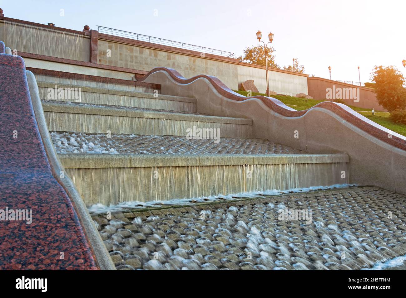 Fountain with a cascade of running water through a granite ladder Stock ...