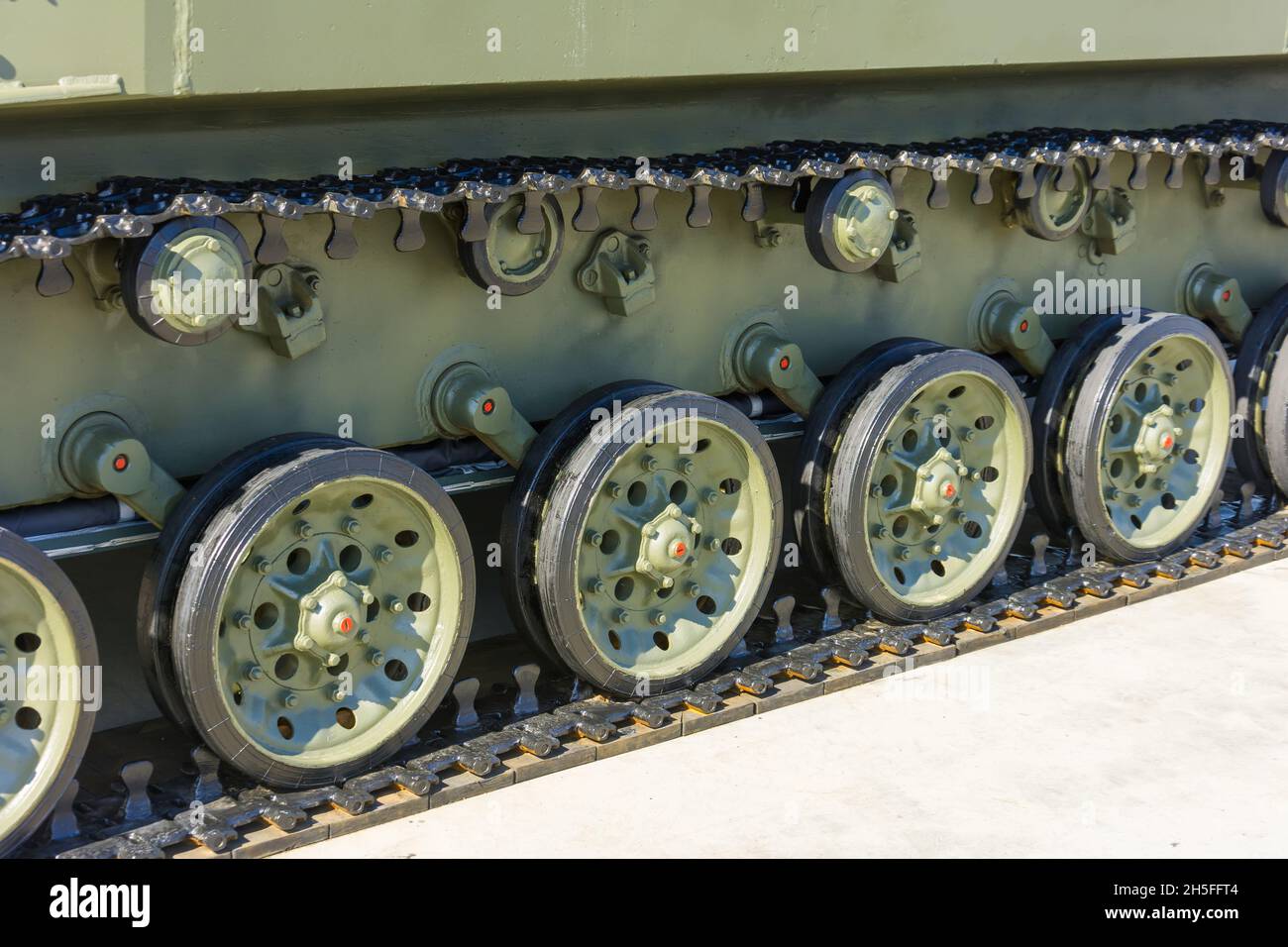 Caterpillar wheels of a tank of green color close-up Stock Photo - Alamy
