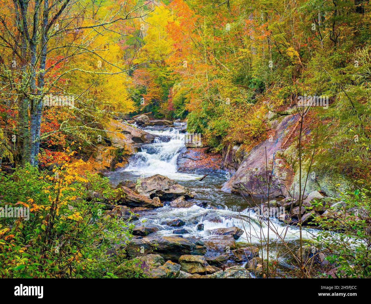 Fall color around small waterfals in the Cullasaja River in Nantahala ...