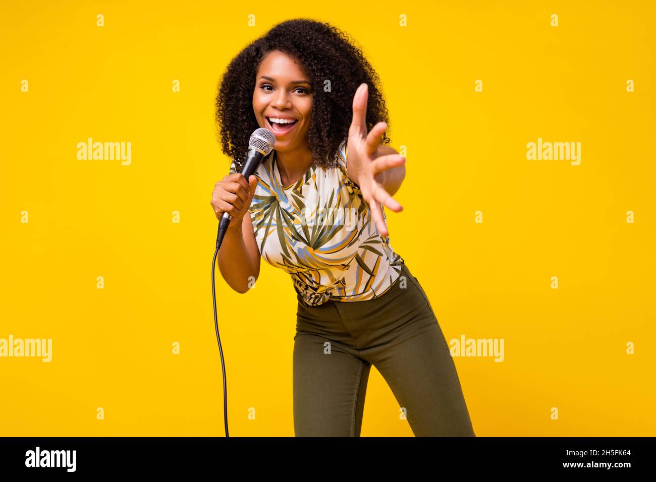 Photo of young cheerful afro girl star stage concert song microphone ...