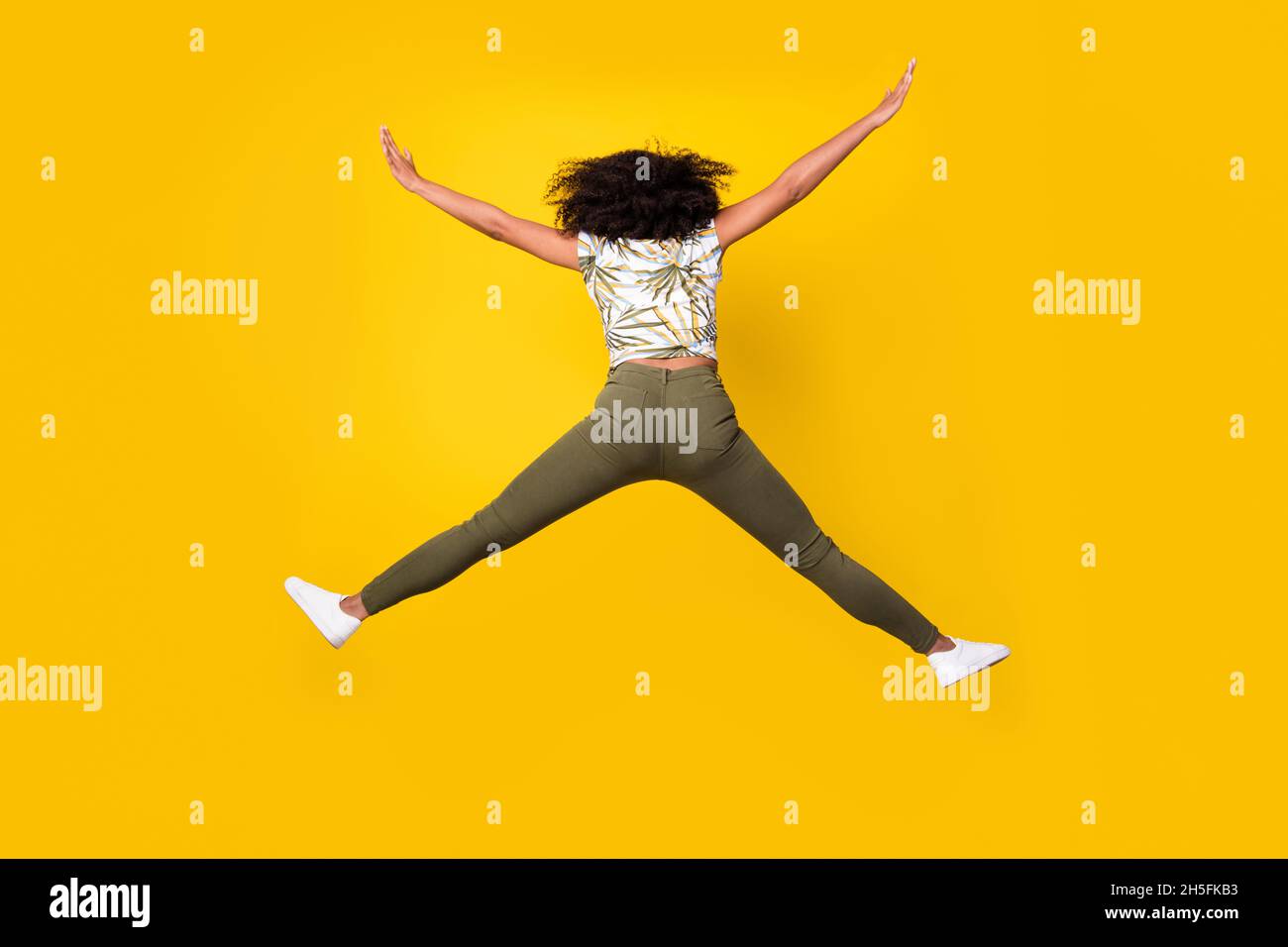 Back rear view full length photo of young african woman jump incognito ...