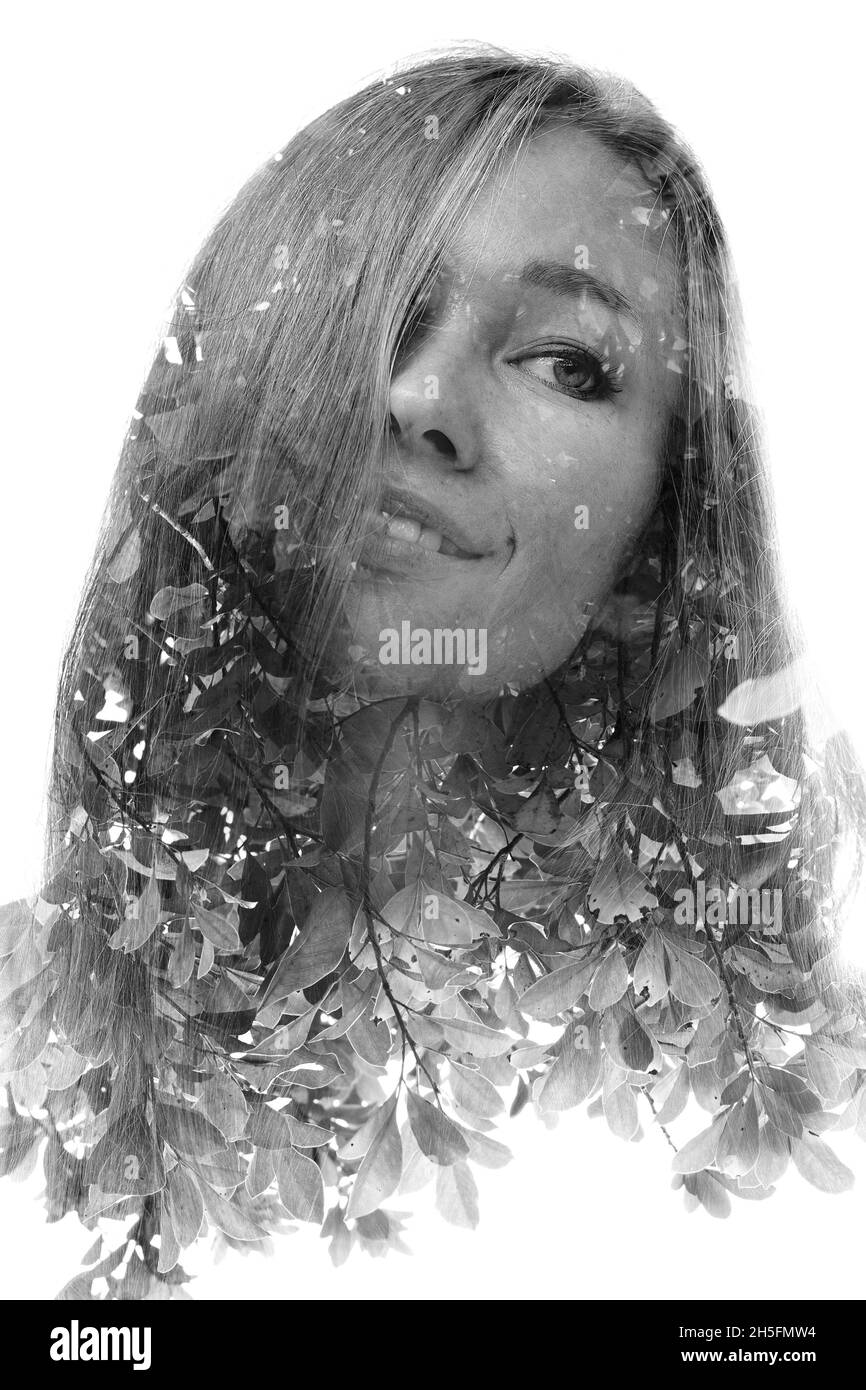 A full face portrait combined with fresh foliage in a double exposure ...
