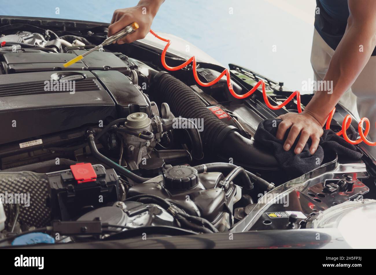 Men working engine check details Stock Photo - Alamy