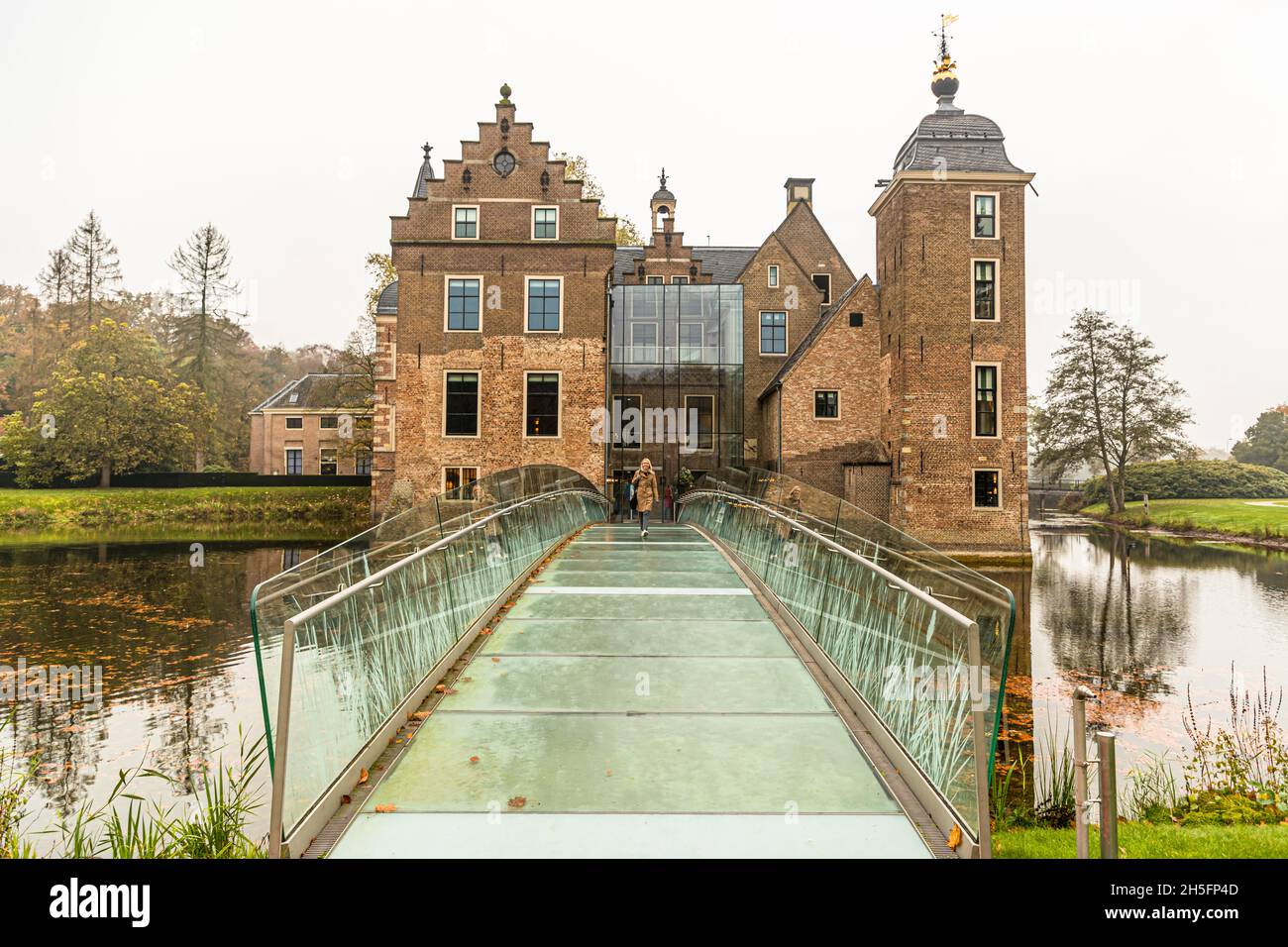 Ruurlo Castle with its glass bridge in the province of Gelderland in ...