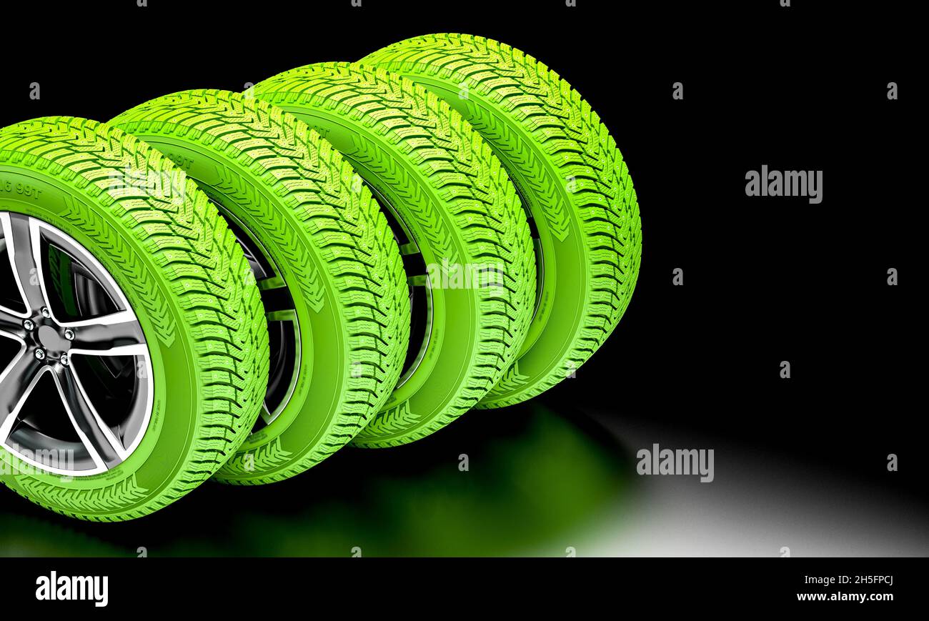 ecological green tires on dark background. 3d render Stock Photo - Alamy