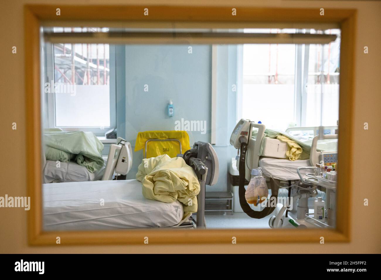 The inside of the covid19 intensive care unit seen through a window in ...