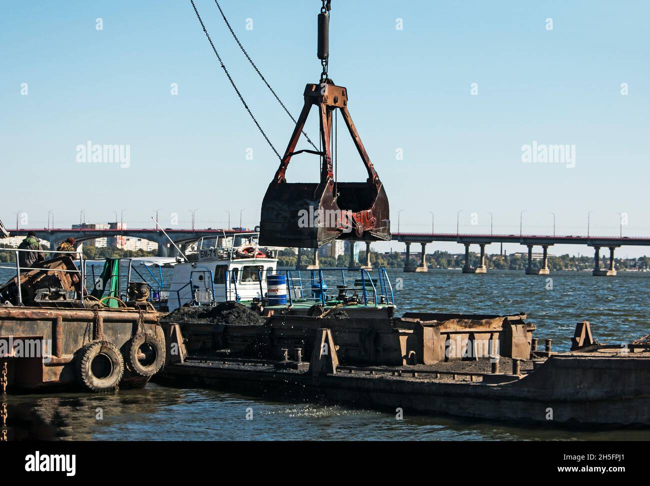 Cleaning the newly formed island from industrial waste on the Dnieper ...