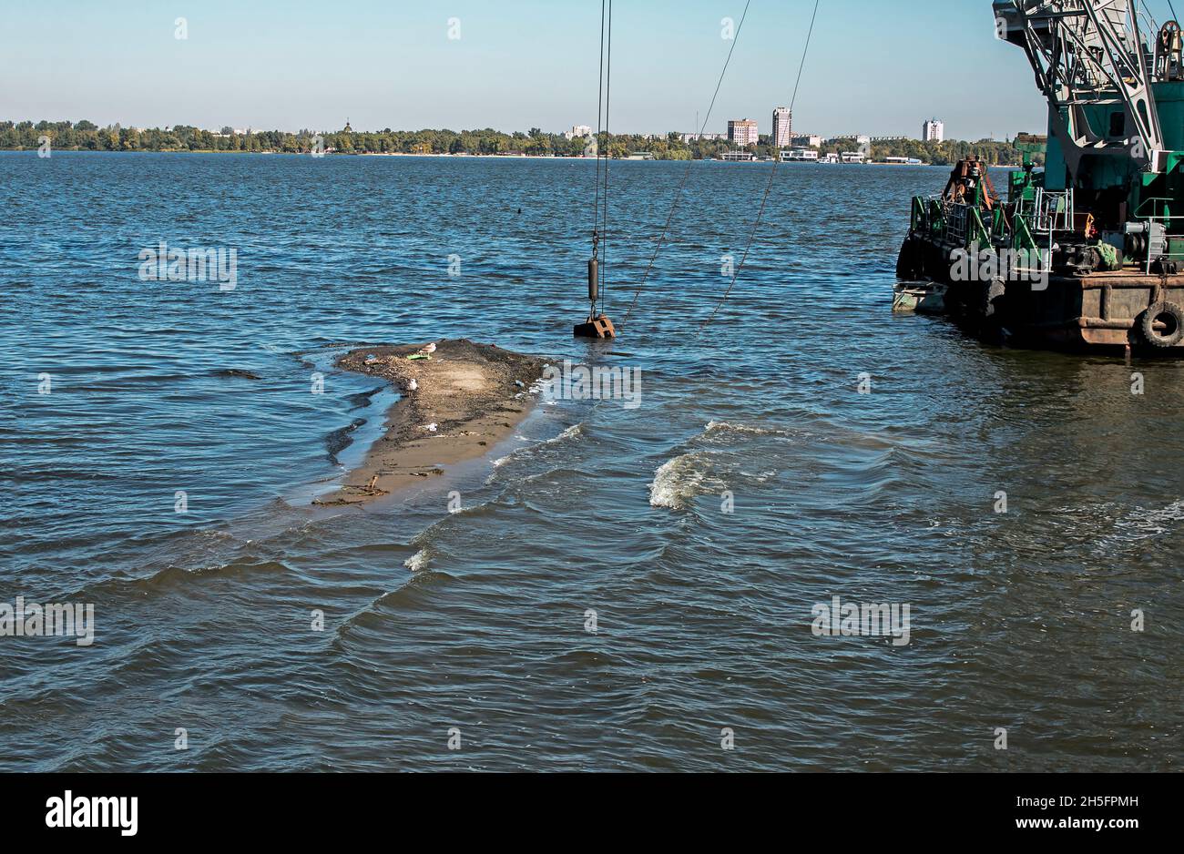 Cleaning the newly formed island from industrial waste on the Dnieper ...