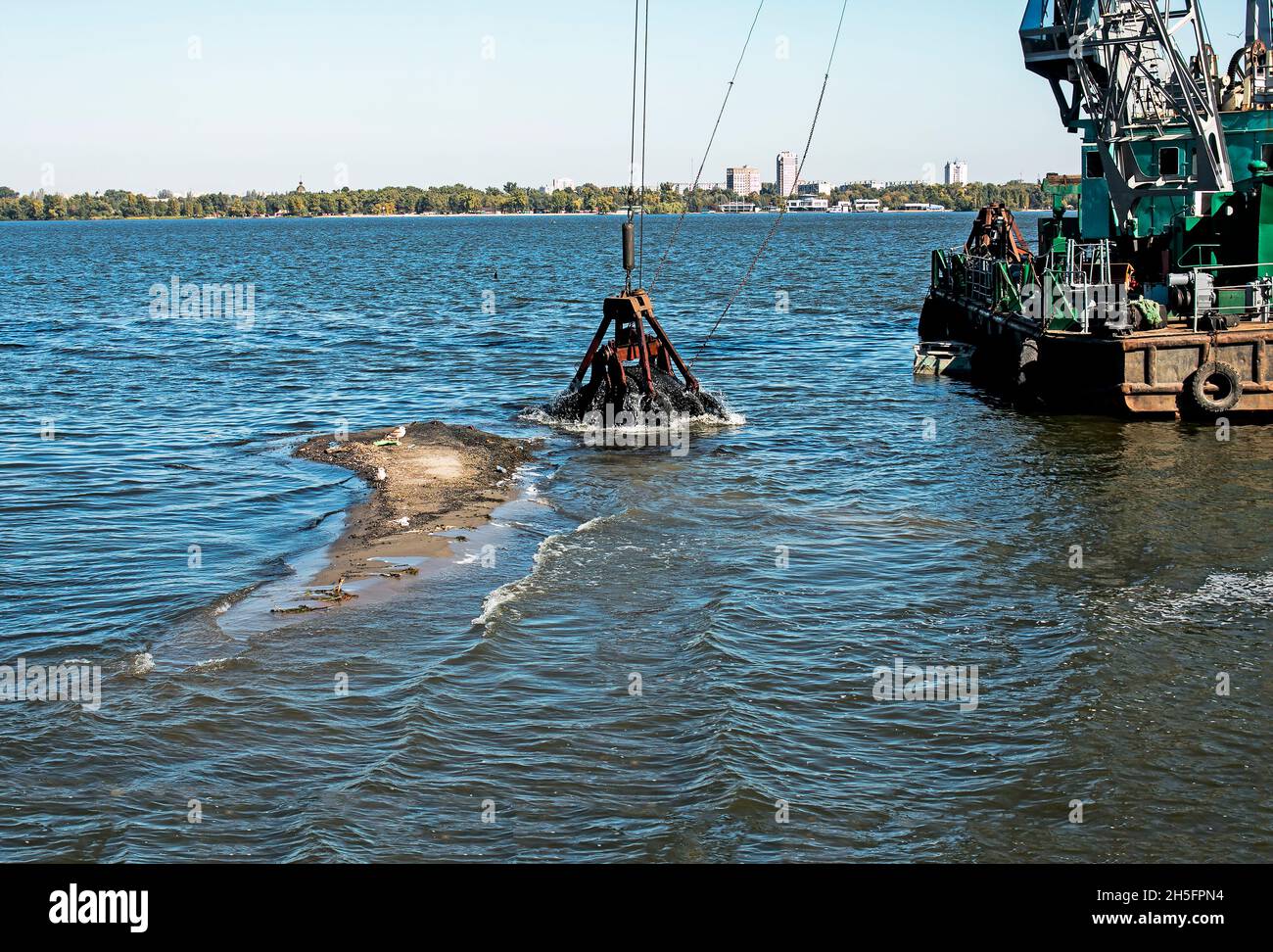 Cleaning the newly formed island from industrial waste on the Dnieper ...