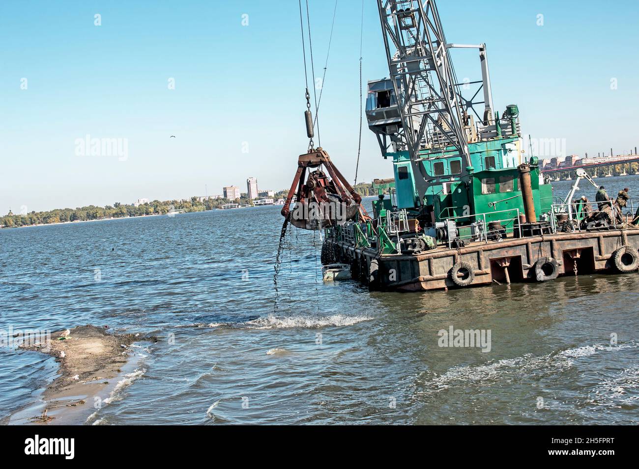 Cleaning the newly formed island from industrial waste on the Dnieper ...
