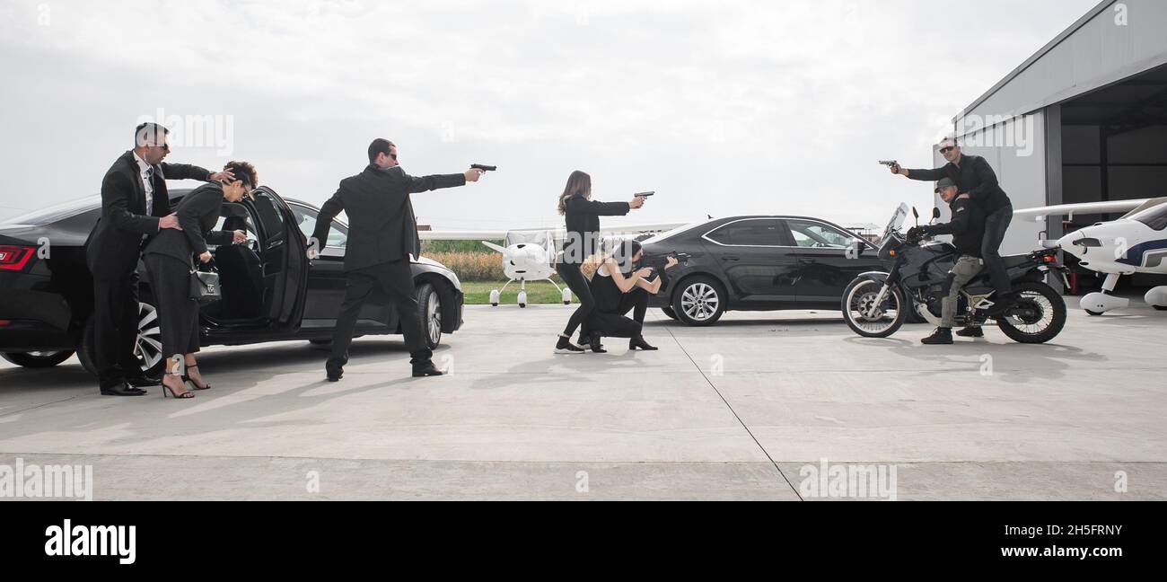 Tactical exercise training. An armed bodyguard security team protects a ...