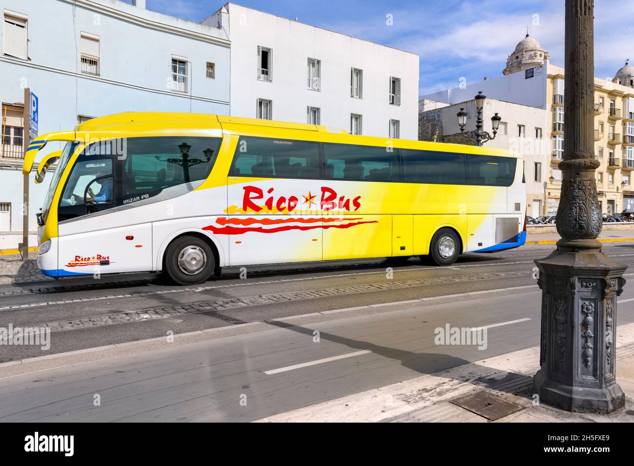 Yellow Rico tour bus Cadiz Spain Stock Photo - Alamy