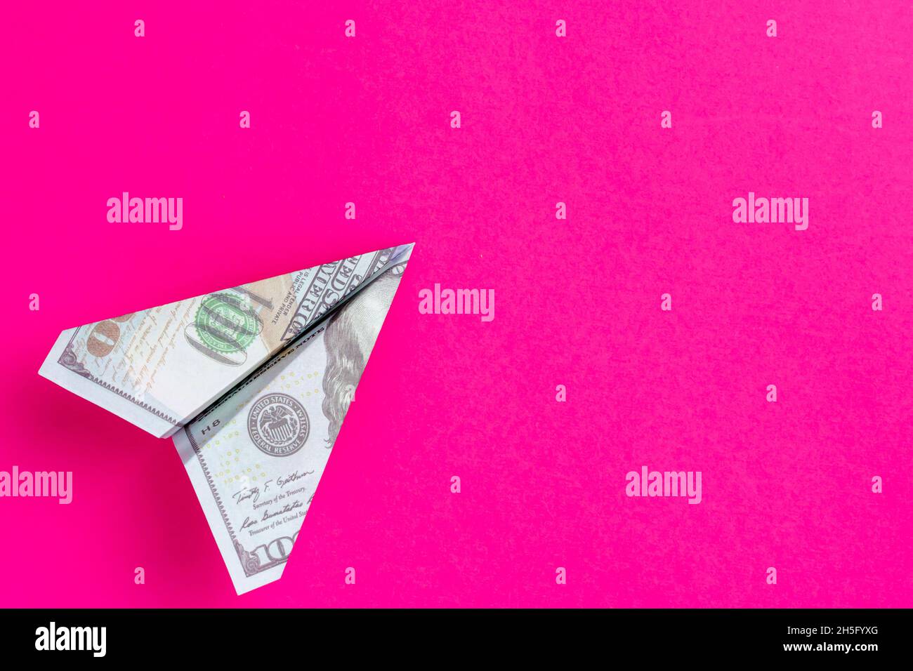 Paper airplane from a dollar bill. Origami craft Stock Photo - Alamy