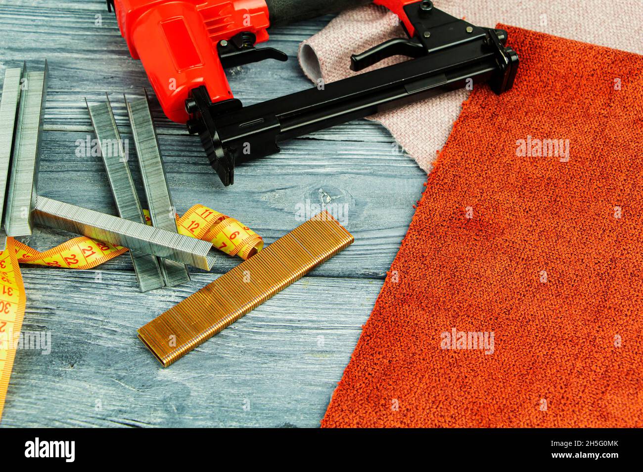 concept of furniture production and repair. Stapler and staples ...