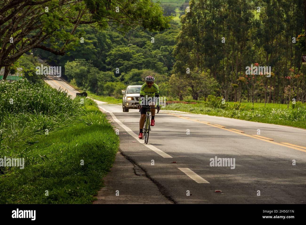 A cyclist pedaling on the highway. Landscape of a section of Highway GO ...