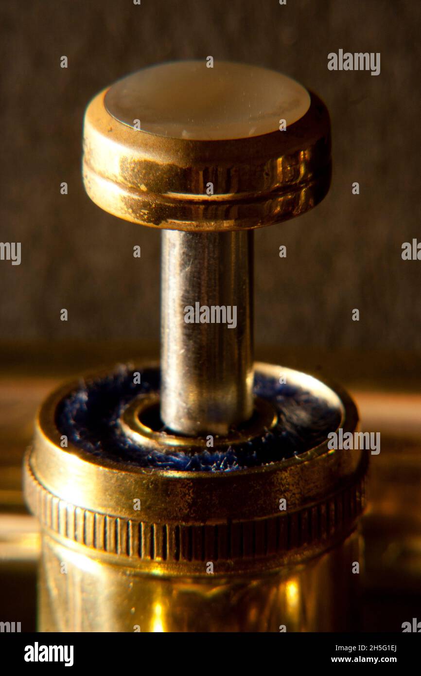 Single brass trumpet valve with differential focus Stock Photo - Alamy