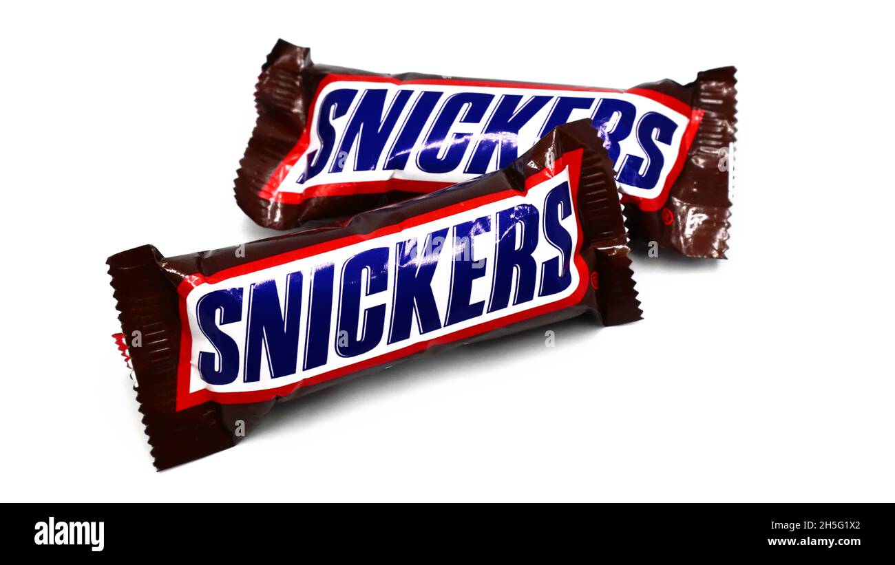 SNICKERS chocolate bar isolated on white background. Snickers is a ...