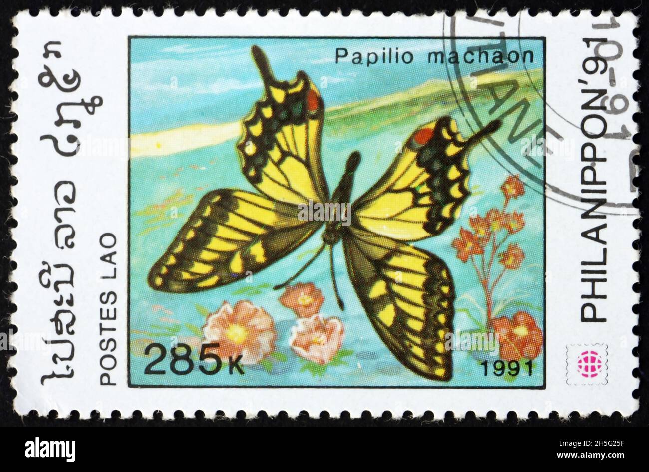 LAOS - CIRCA 1991: a stamp printed in Laos shows old world swallowtail ...