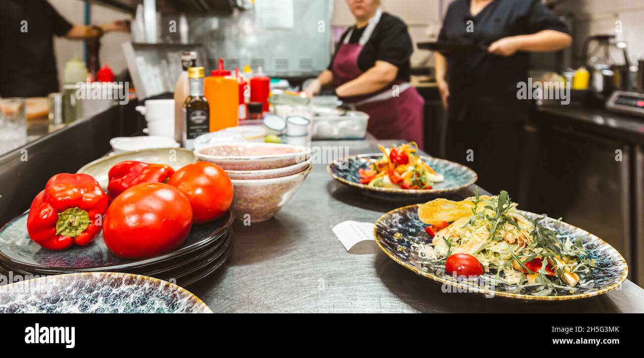 Professional chef cooking in the kitchen restaurant at the hotel ...