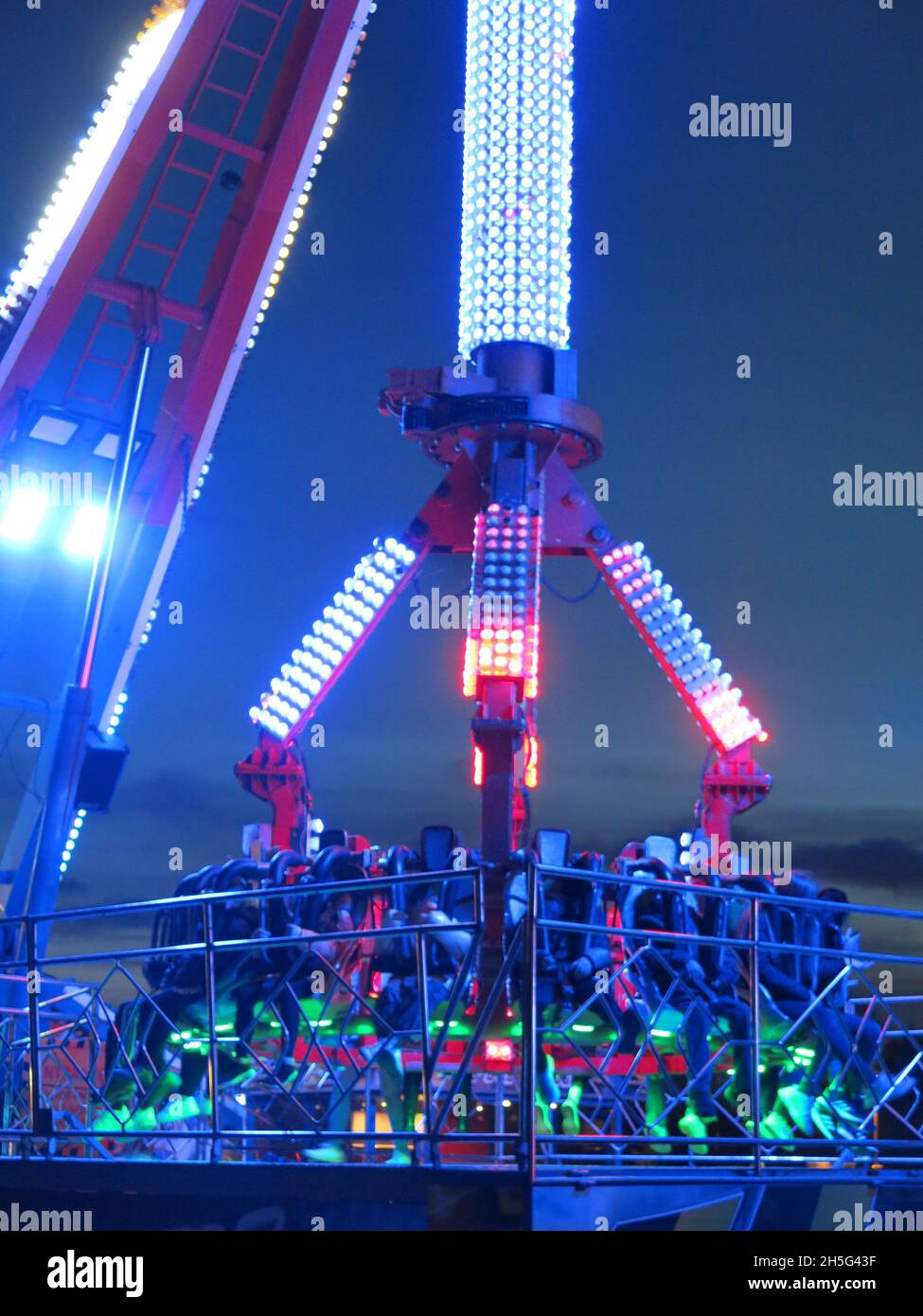 Children strapped in their seats with legs dangling, ready for a white ...