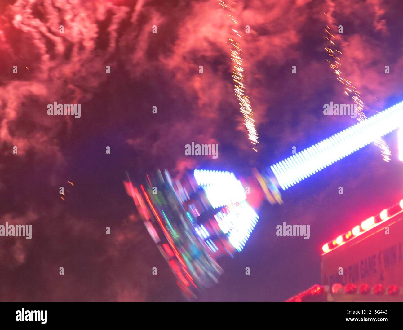 For adrenaline enthusiasts: the illuminated swinging, rotating arm of a Vortex fairground ride ...