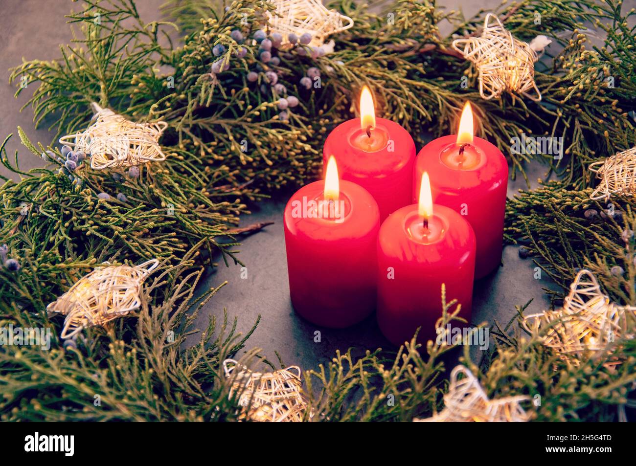 Advent wreath with 4 burning candles. Christmas advent wreath with ...