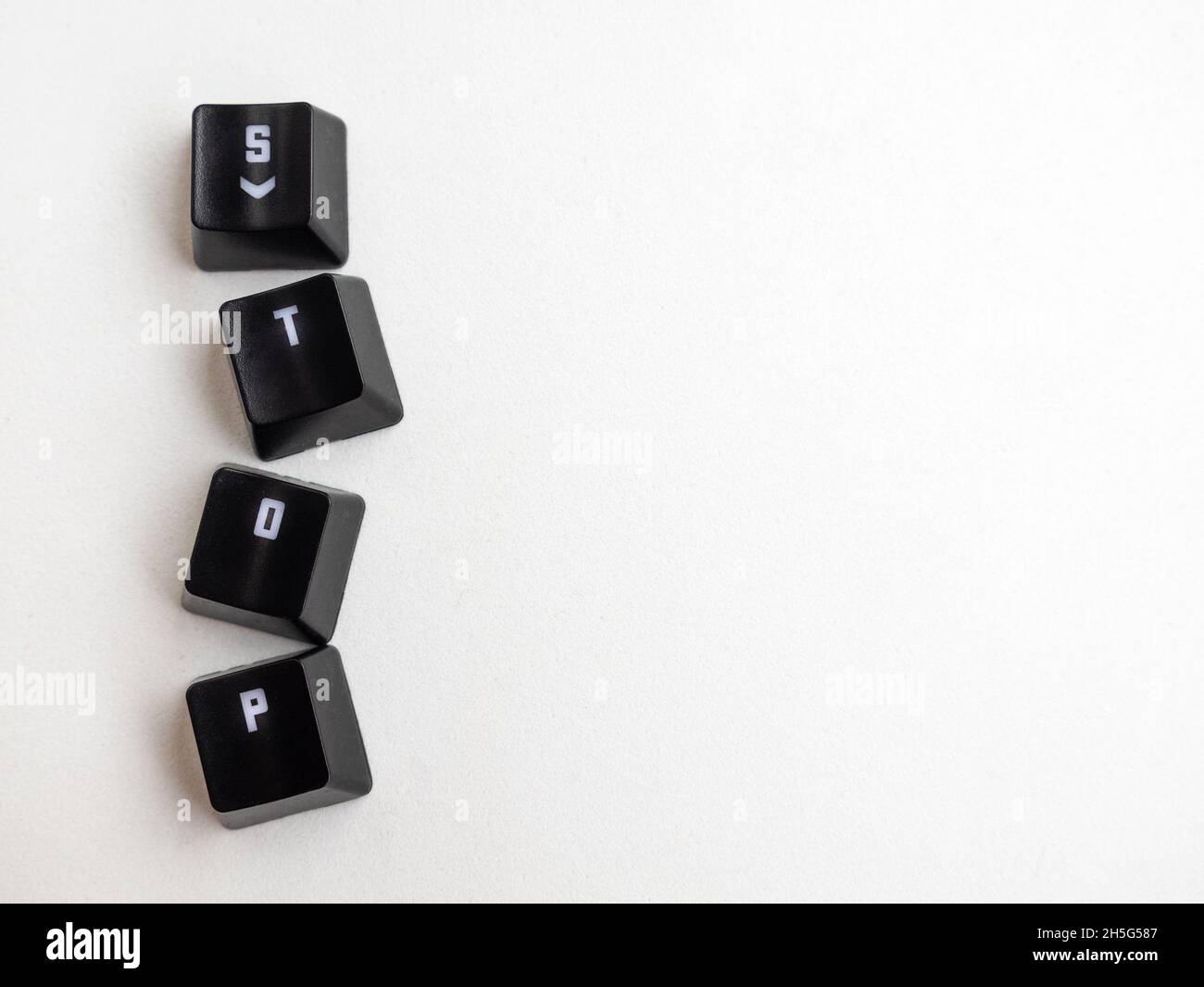 Keys with the word stop with white background Stock Photo - Alamy