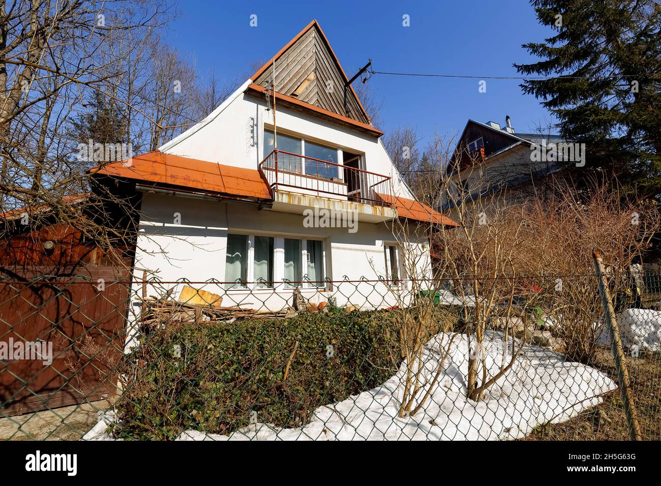 Zakopane, Poland - March 09, 2015: House covered with a sloping roof ...