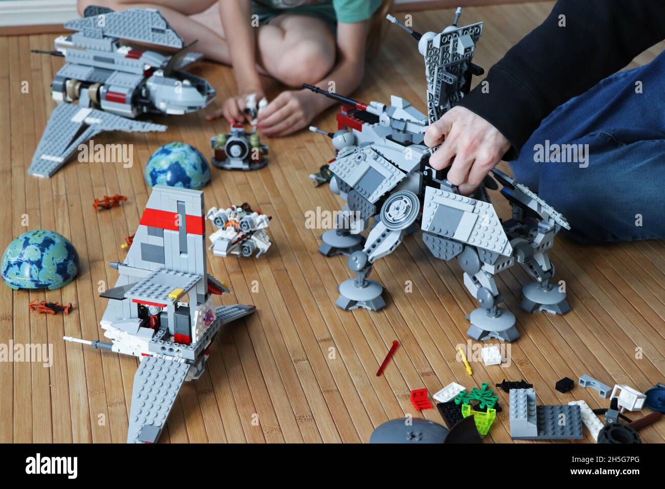 Siblings creating their own imaginary world with Lego Star Wars Stock ...