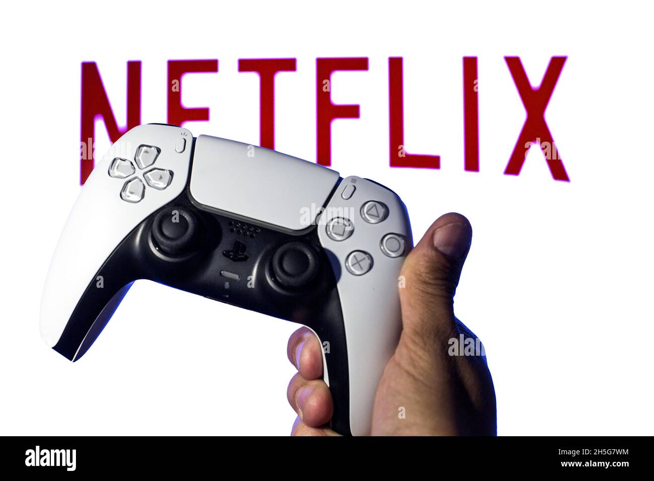 In this photo illustration, a PlayStation 5 controller seen with a ...