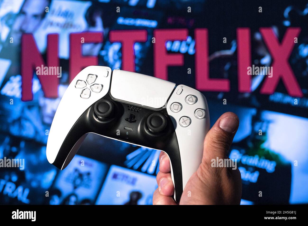 In this photo illustration, a PlayStation 5 controller seen with a ...