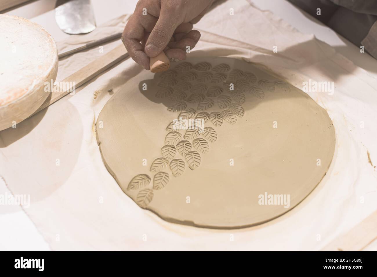 Pottery artist make shape on clay for molding. Creative handmade craft ...