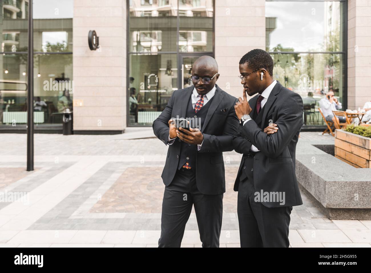 Meeting of two partners black african american businessman in suits and ...