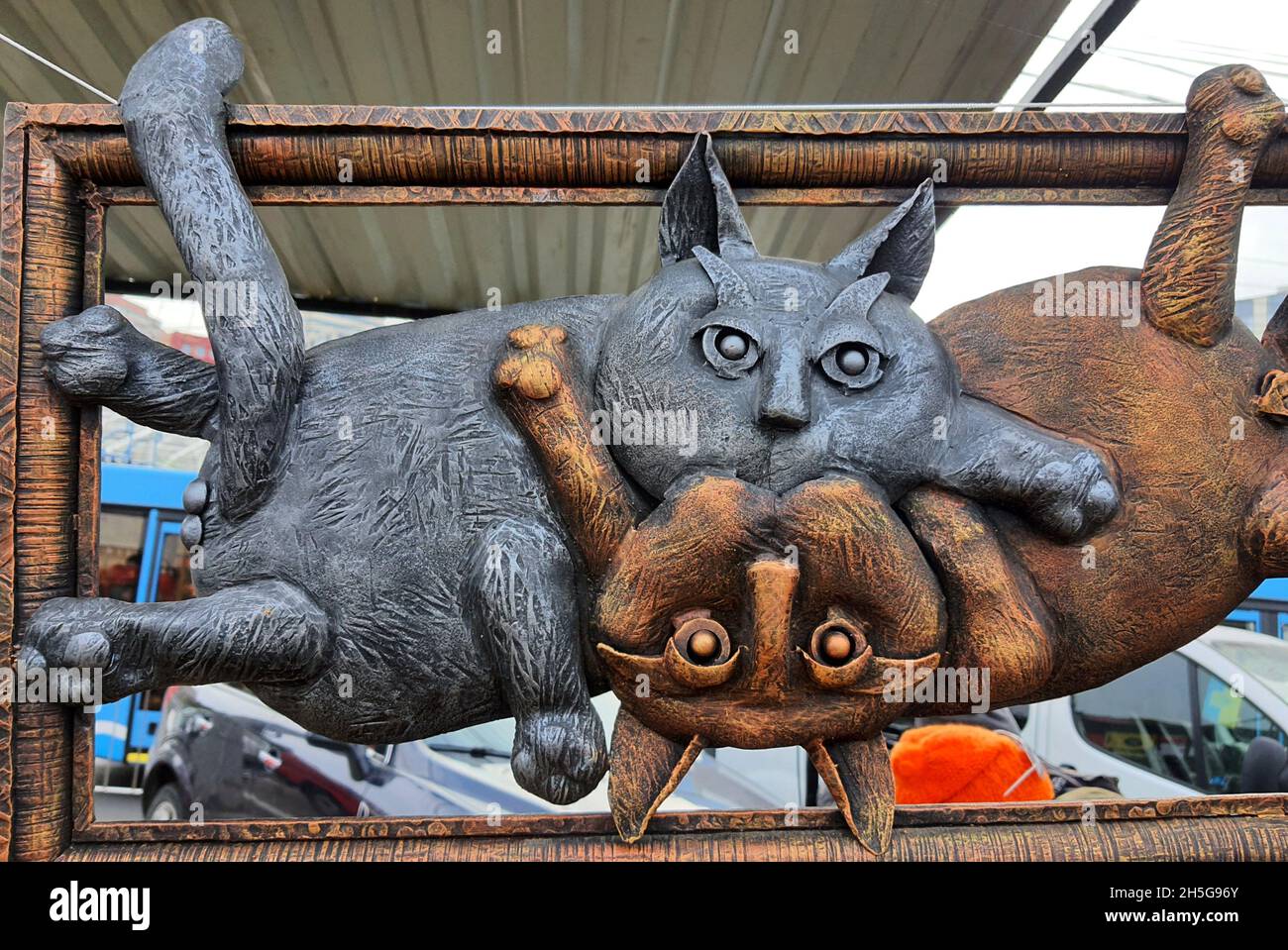 Forged metal figurines, 2 funny unusual iron cats are shown at ...