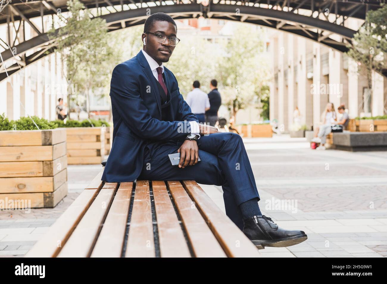 Portrait of a black African American businessman in a suit, glasses and ...