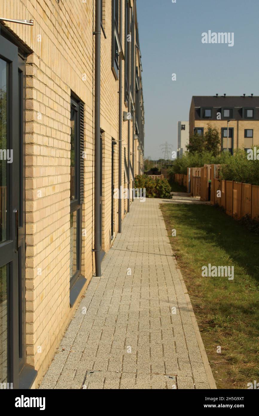 Walkway Down The Back Of Buildings Stock Photo - Alamy