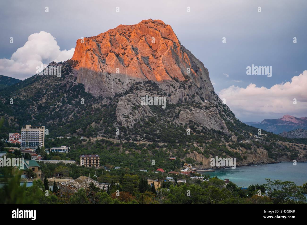Mount Falcon lit by pink sunset in Novyi Svit during autumn season ...
