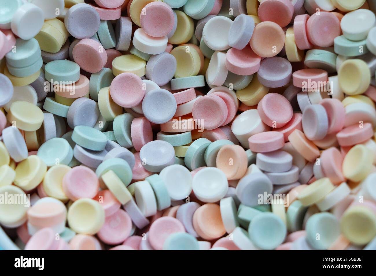 A pile of pastel colored, small, round, candies Stock Photo - Alamy
